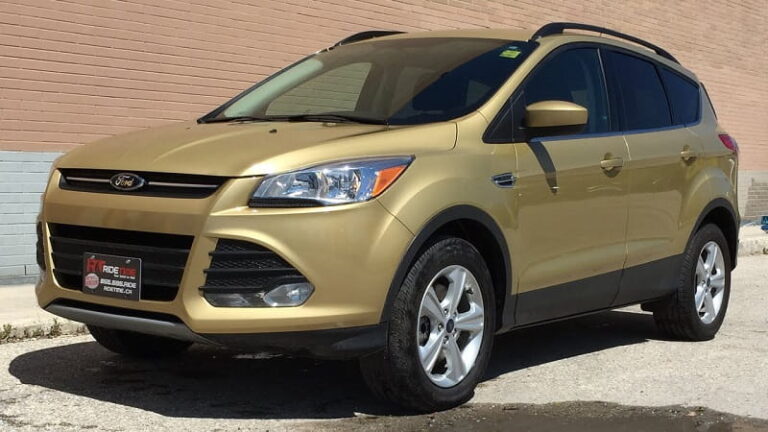 Gold Ford Escape - Dump Truck
